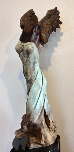 Figurative wood, stone & bronze sculpture by Crystal Lockwood